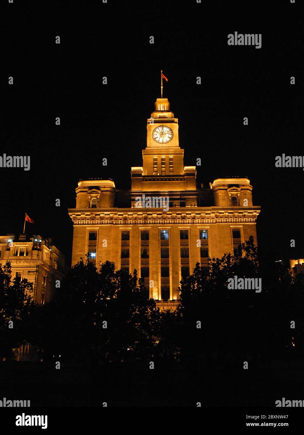 The Custom House on the Bund in Shanghai, China. The Bund is a ...
