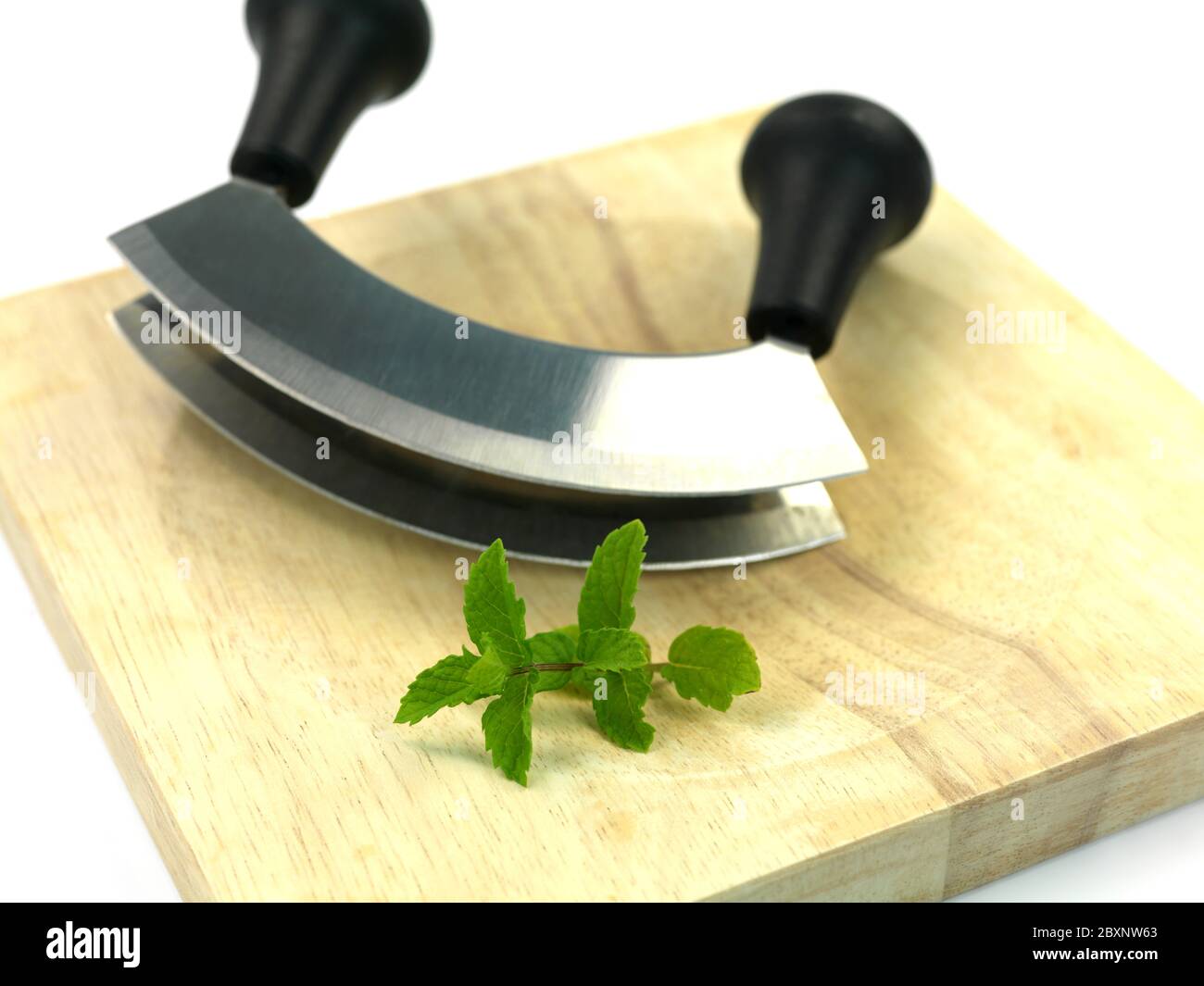 Mint herbs on a cutting board isolated against a white background Stock ...