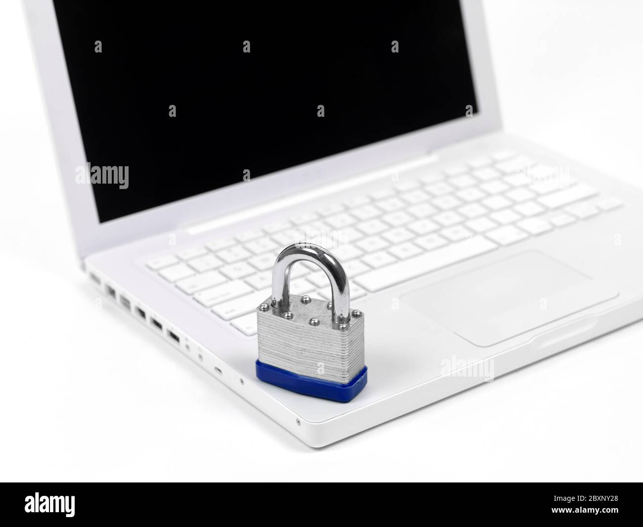 A laptop computer and a padlock isolaterd against a white background ...