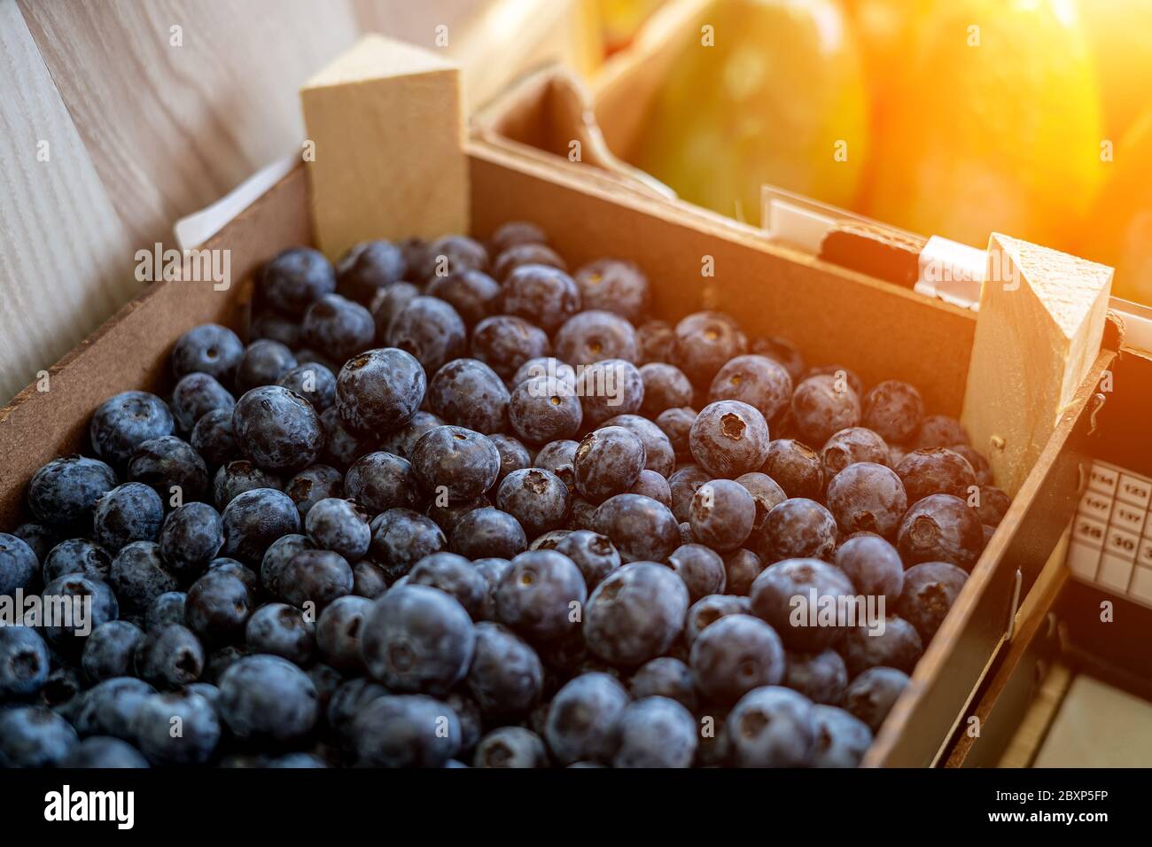 blueberries in a box on the market Stock Photo - Alamy