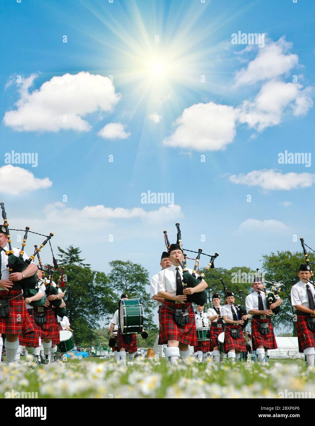 Marching scottish band marching on grass Stock Photo - Alamy