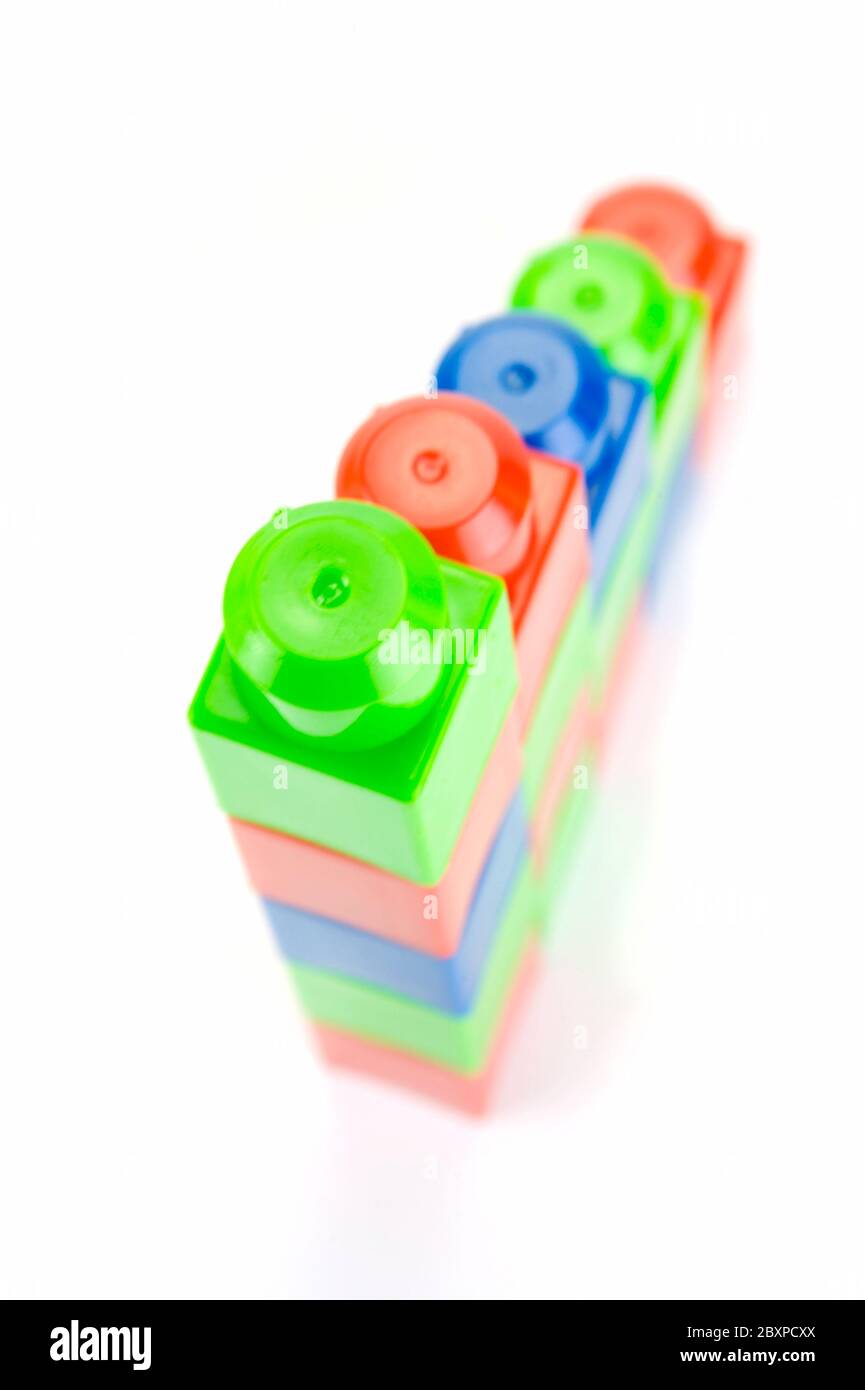 Building blocks isolated against a white background Stock Photo - Alamy