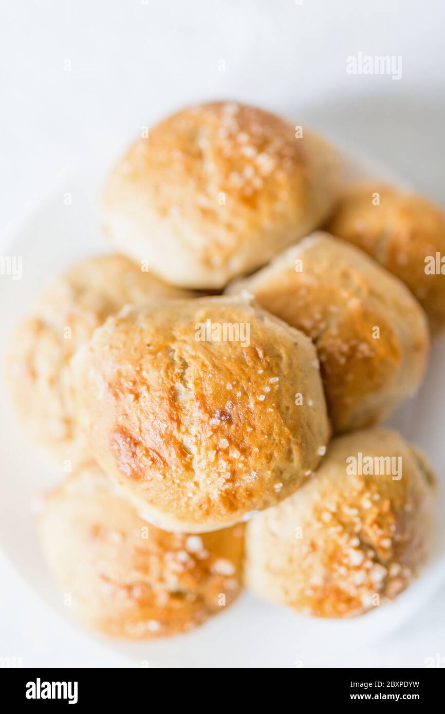 Fresh salty bread buns pastry topped with salt Stock Photo - Alamy