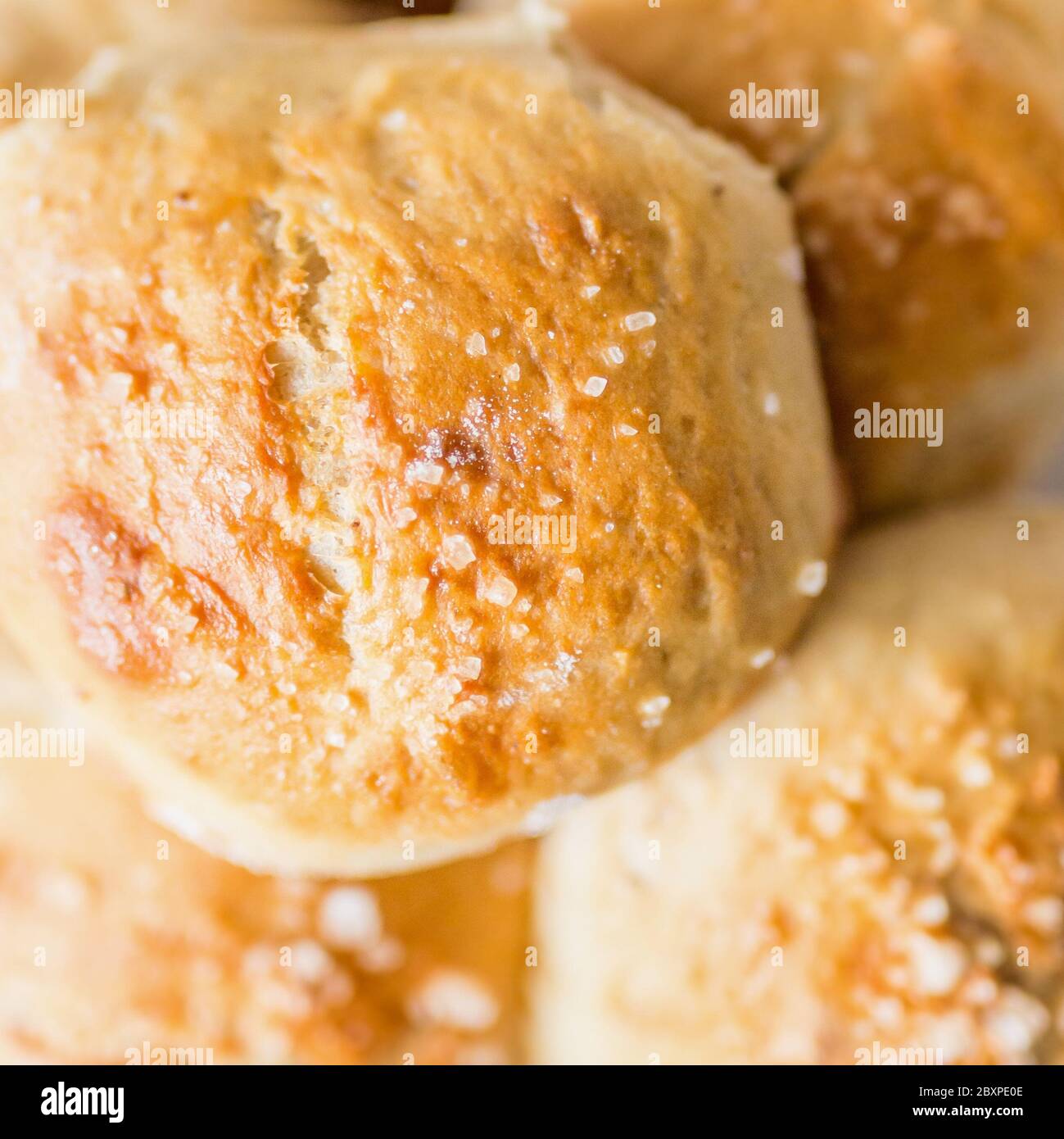 Fresh salty bread buns pastry topped with salt Stock Photo - Alamy