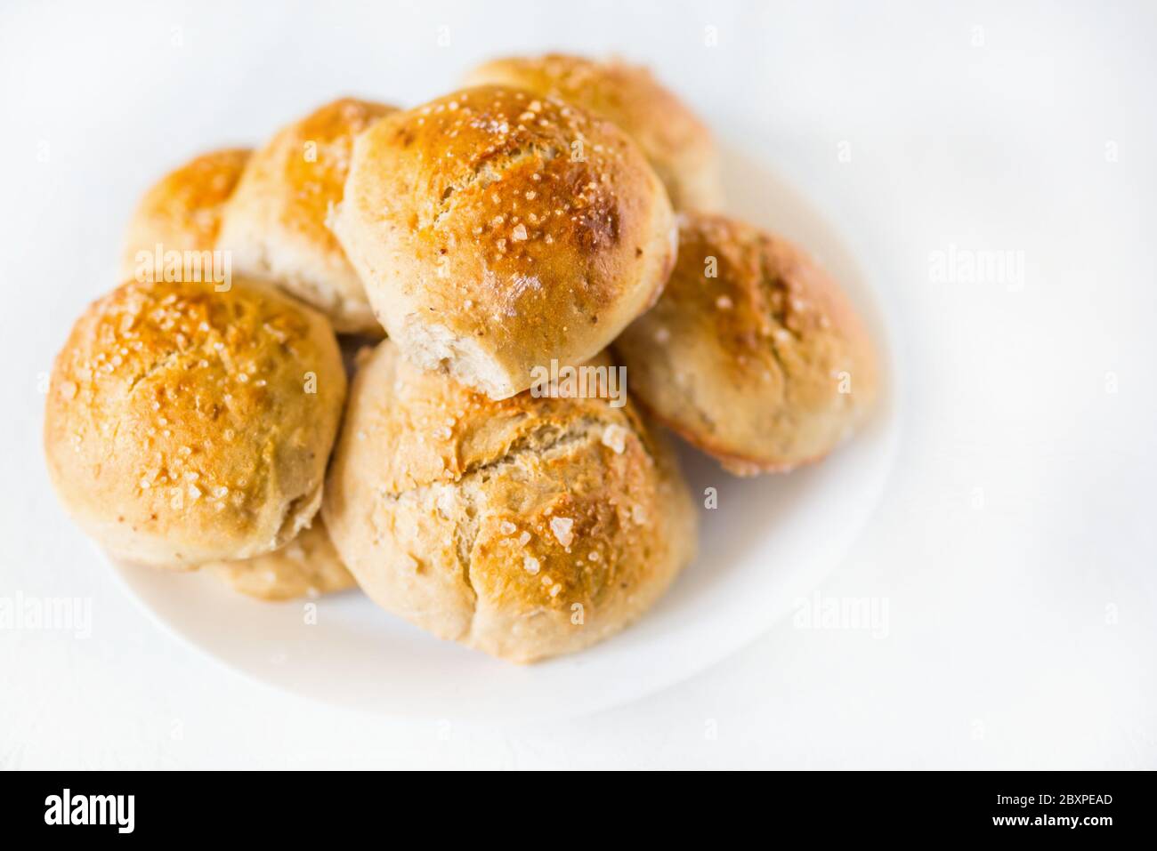 Fresh salty bread buns pastry topped with salt Stock Photo - Alamy