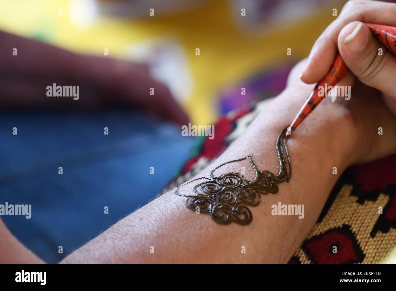 Process of applying traditional Mehndi henna on female hand Stock Photo ...