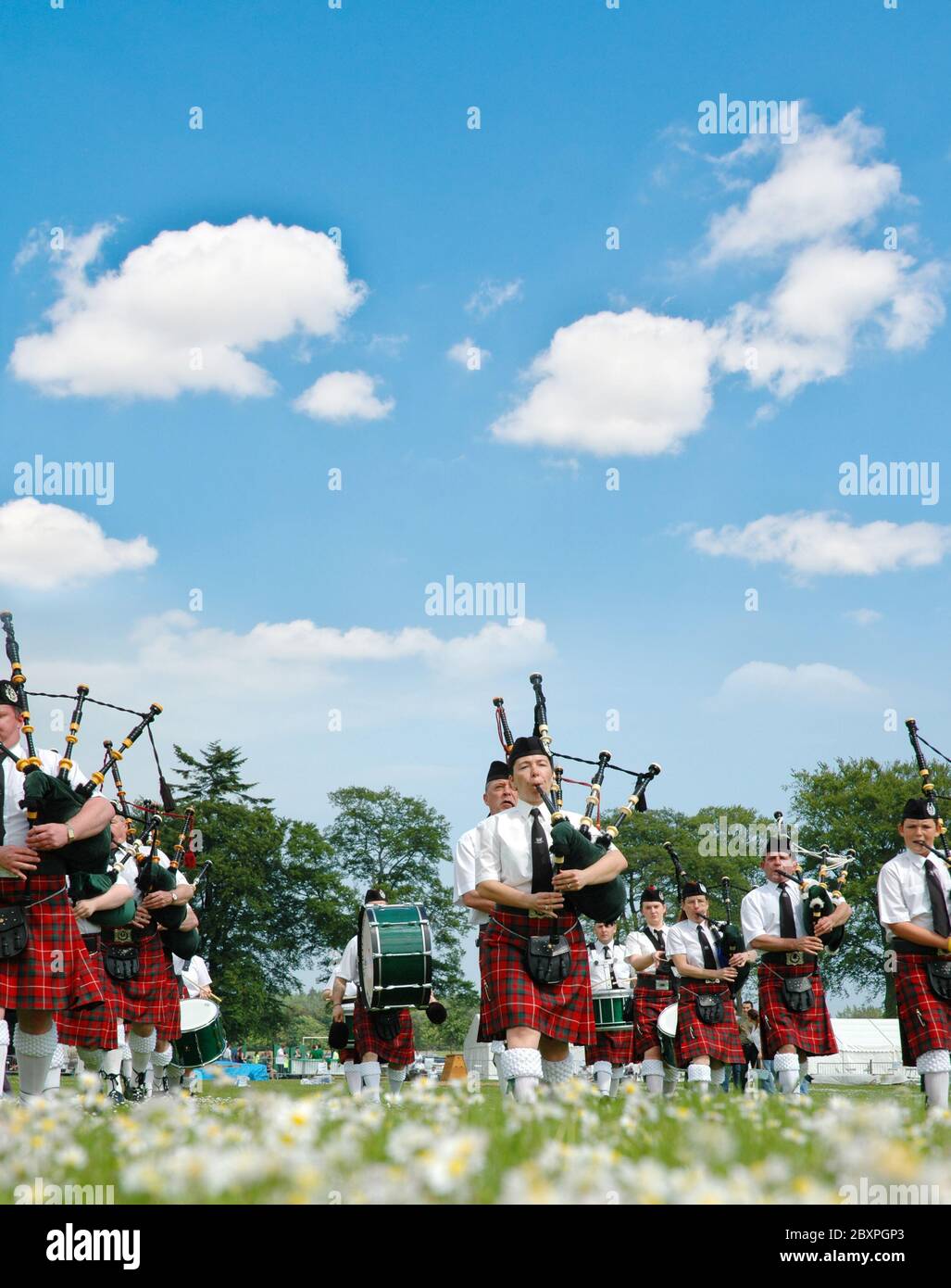 Marching scottish band marching on grass Stock Photo - Alamy