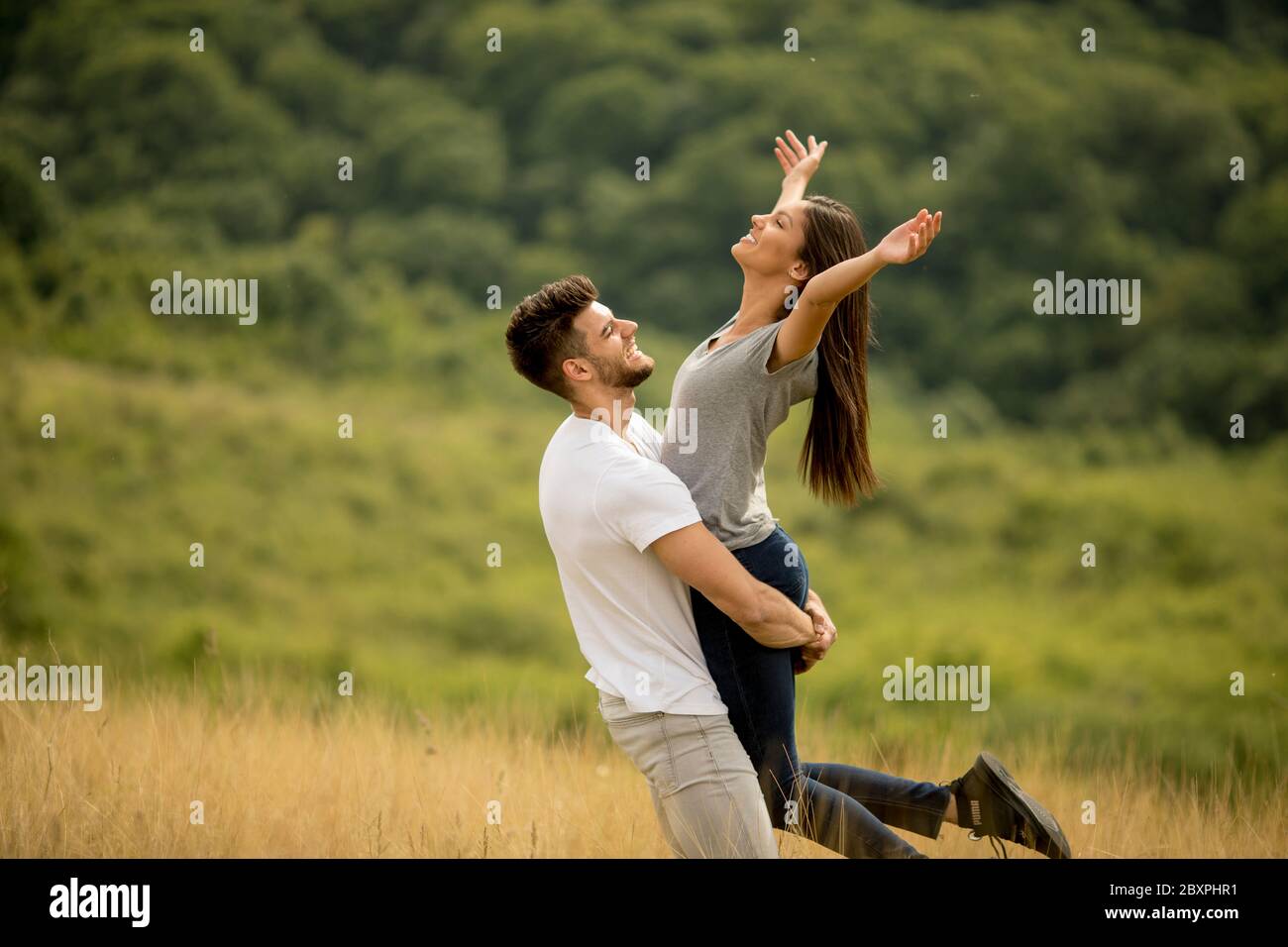 Guy holding girlfriend in arms hi-res stock photography and images - Alamy