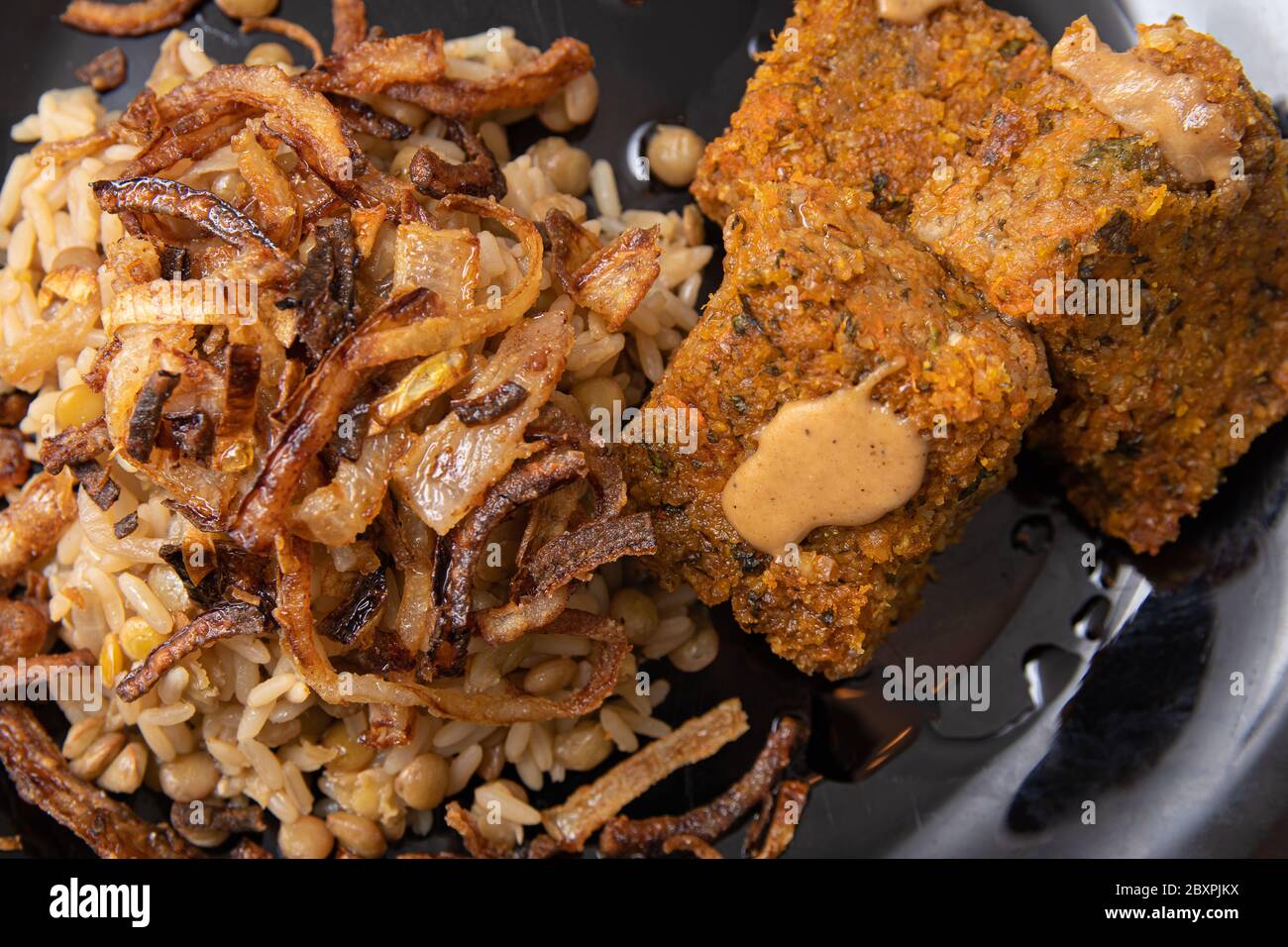 Mjadra, Mujaddara and kibbeh. Rice with lentil with crispy onion Stock ...