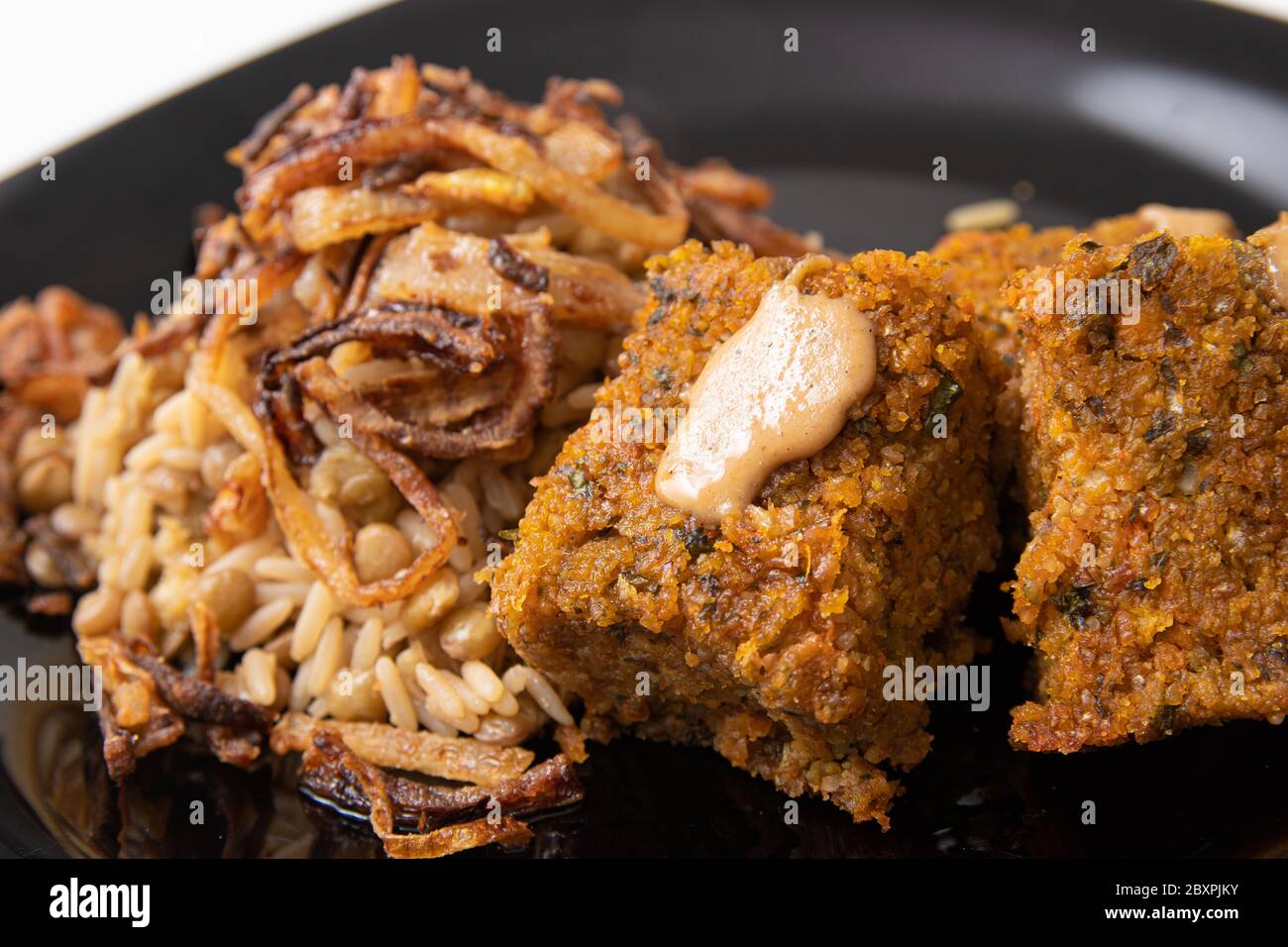 Mjadra, Mujaddara and kibbeh. Rice with lentil with crispy onion Stock ...