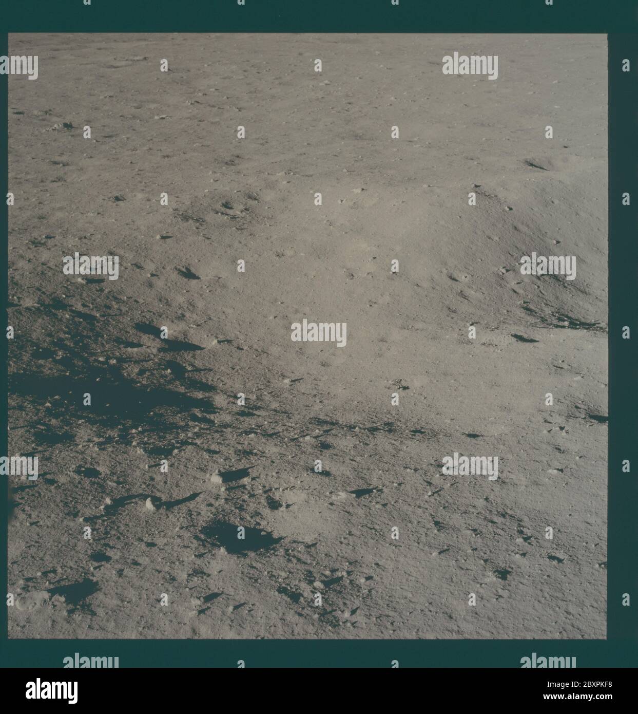 AS11-37-5459 - Apollo 11 - Apollo 11 Mission image - Shallow crater on ...