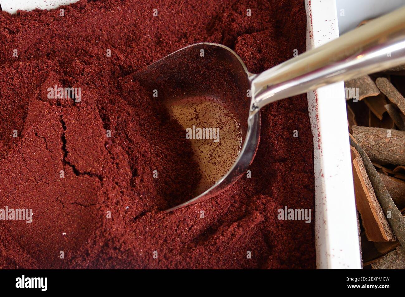 Red Sumac Berries spice in white box with a large metal shovel, top ...
