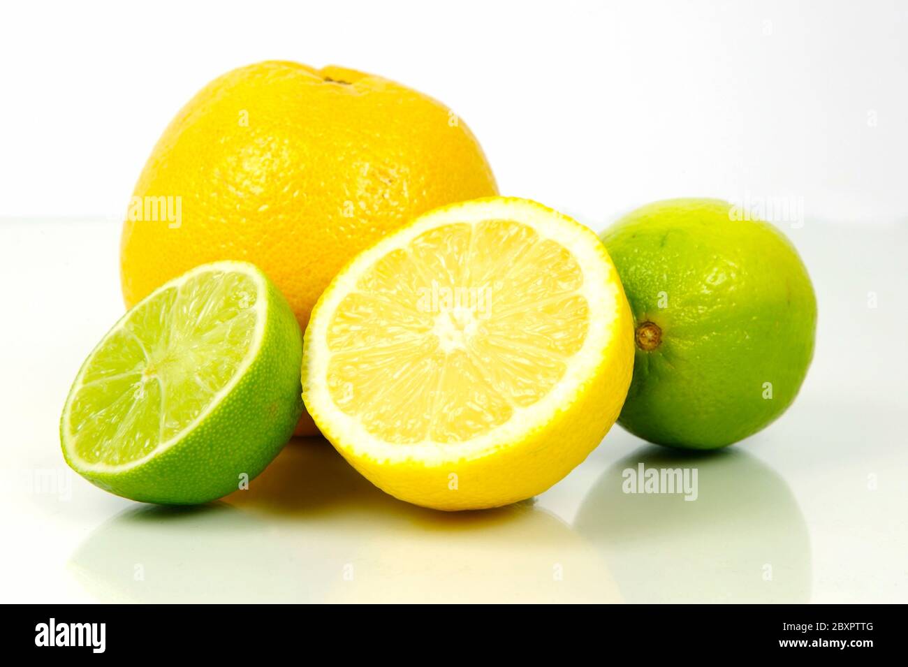 Citrus fruits isolated against a white background Stock Photo - Alamy