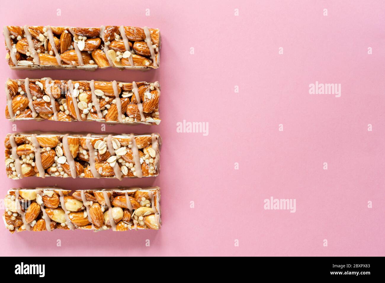Almond Protein Granola Bars On Pink Background Healthy Snack For