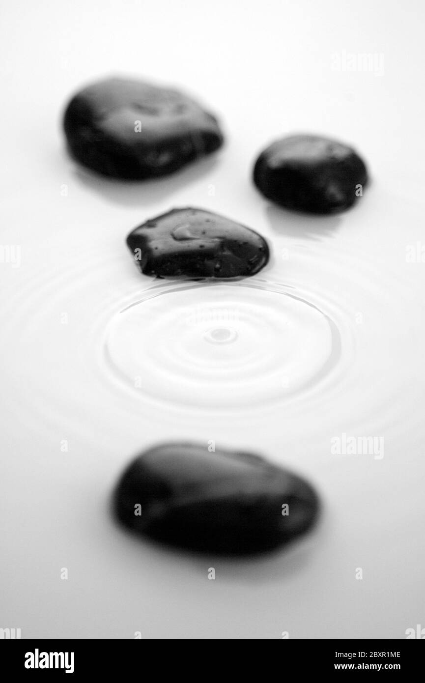 Black river rocks Stock Photo - Alamy