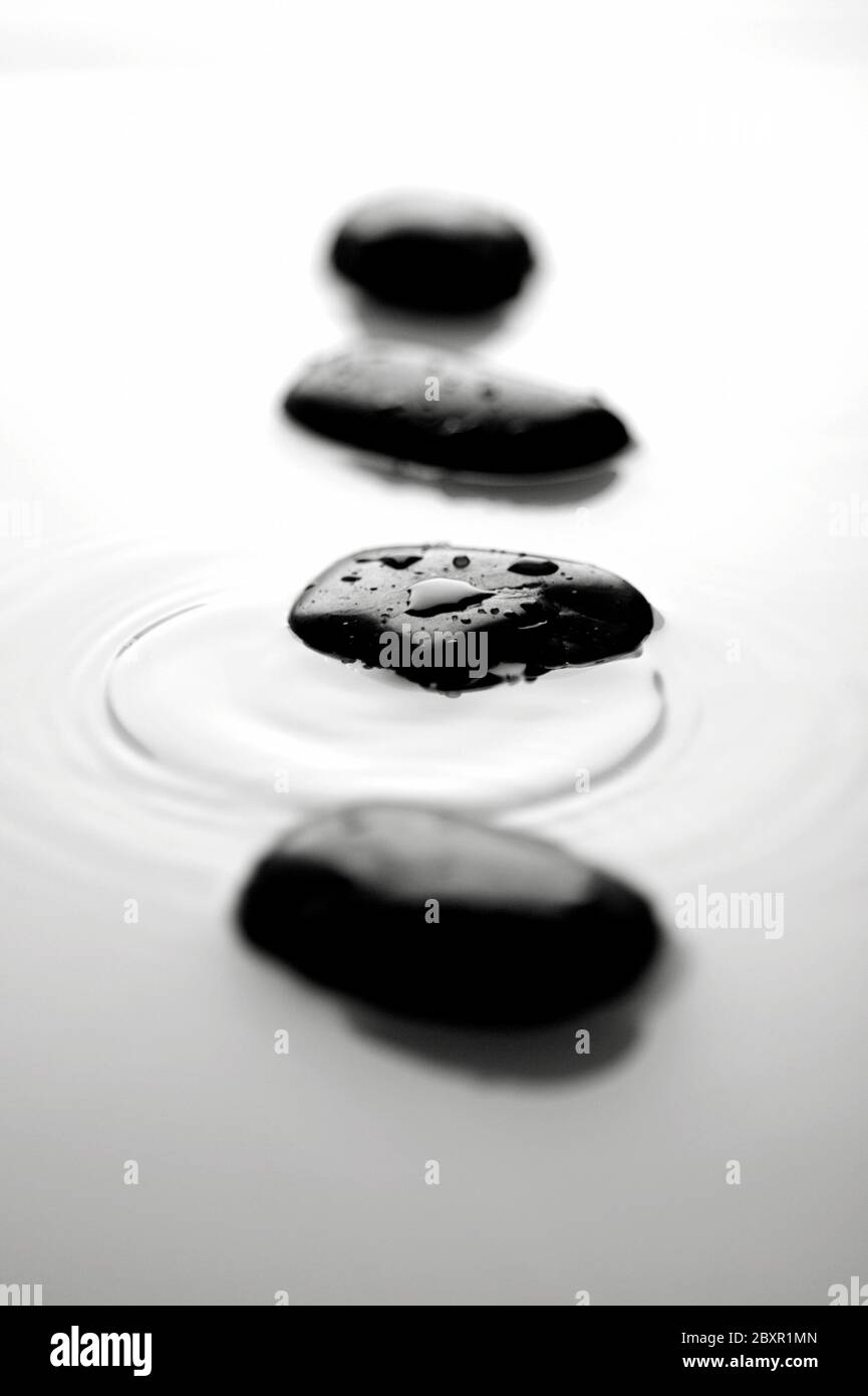 Black river rocks Stock Photo - Alamy