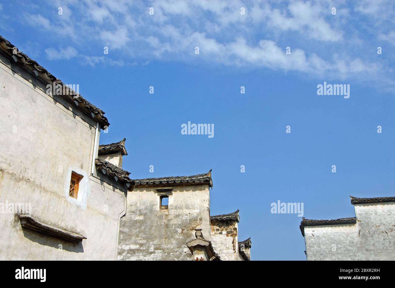 Xidi Ancient Town in Anhui Province, China. Traditional roofs and white ...