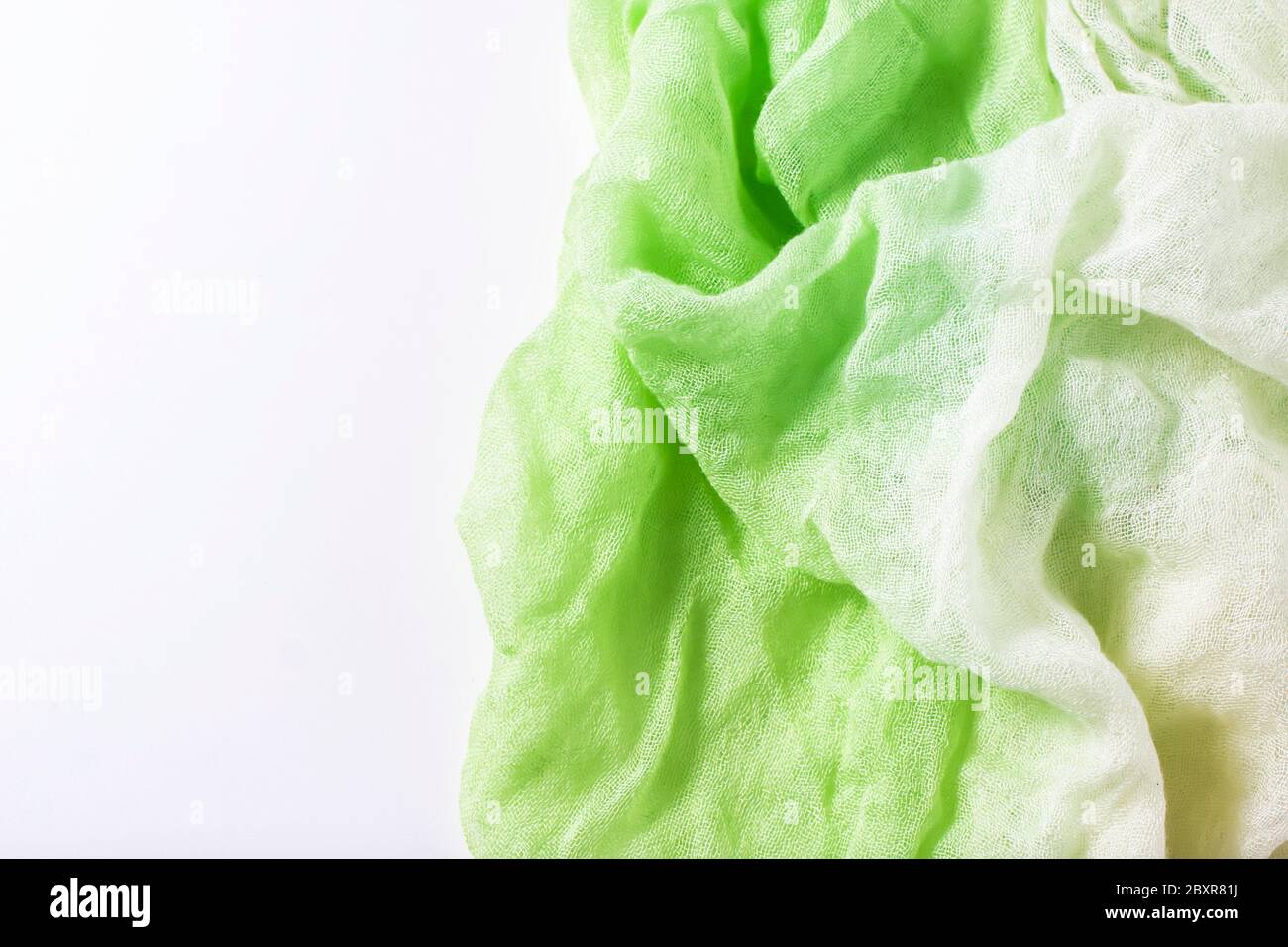 Bright green fabric folded to be used as background Stock Photo - Alamy