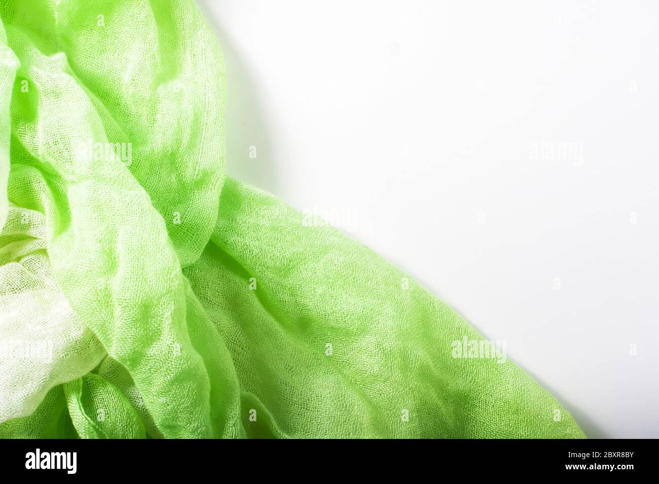Bright green fabric folded to be used as background Stock Photo - Alamy