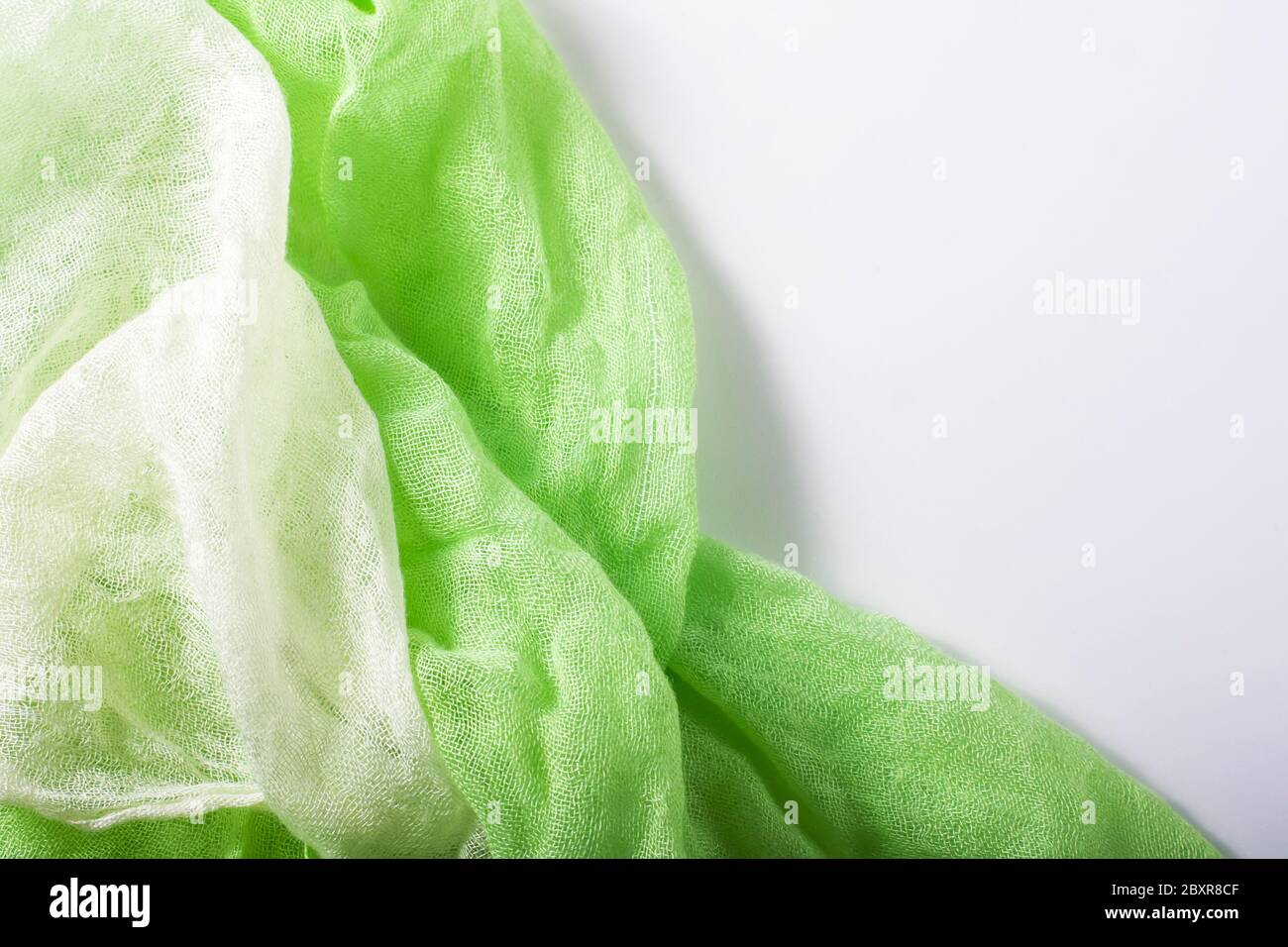 Bright green fabric folded to be used as background Stock Photo - Alamy