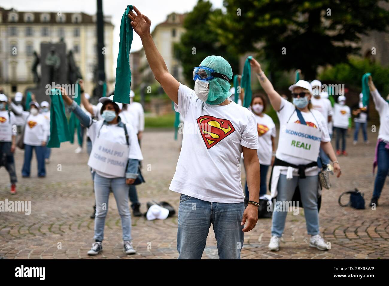 Turin, Italy - 08 June, 2020: Protesters hold gags during a flash mob ...