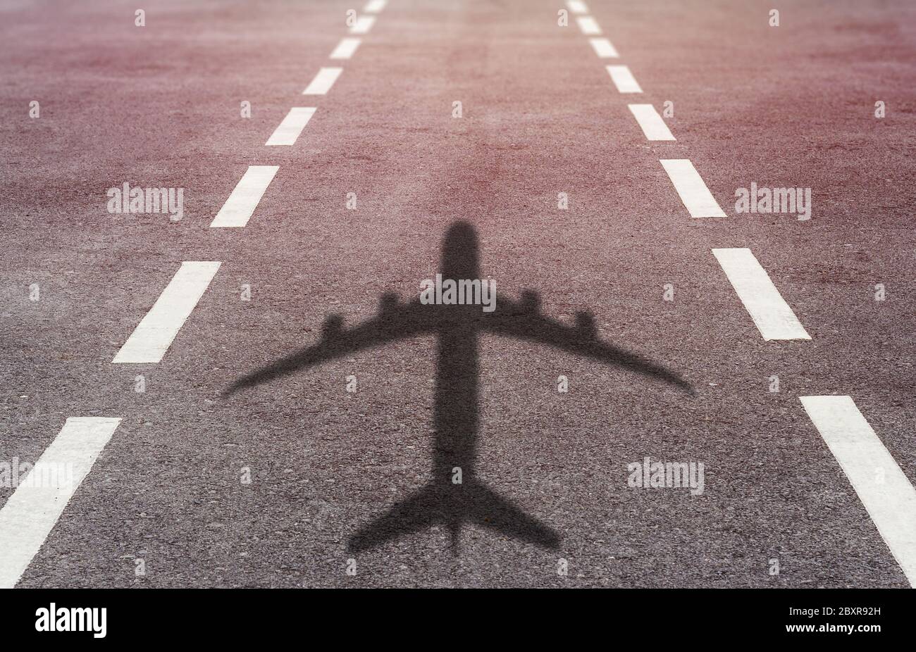 Travel concept, airplane shadow on runway Stock Photo - Alamy