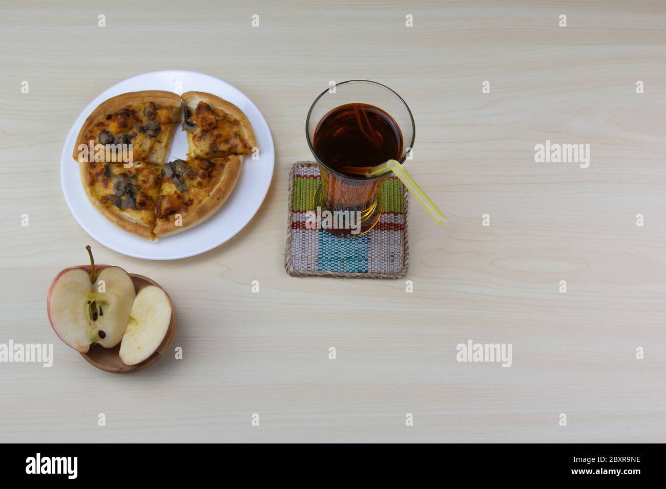 Dinner with pizza and apple juice for healthy menu Stock Photo - Alamy