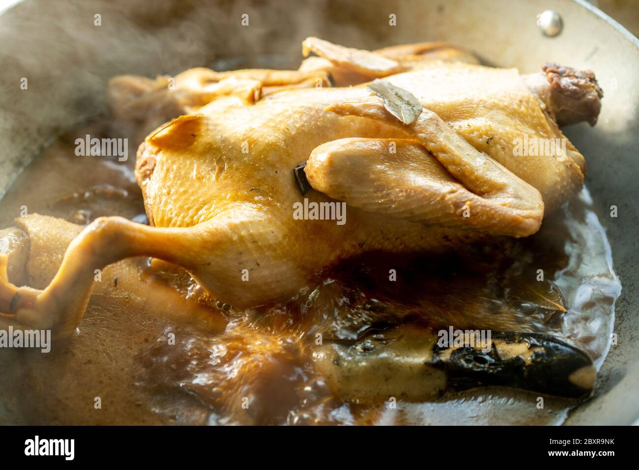 Braised duck being made in the pot, boiling soup water Stock Photo - Alamy