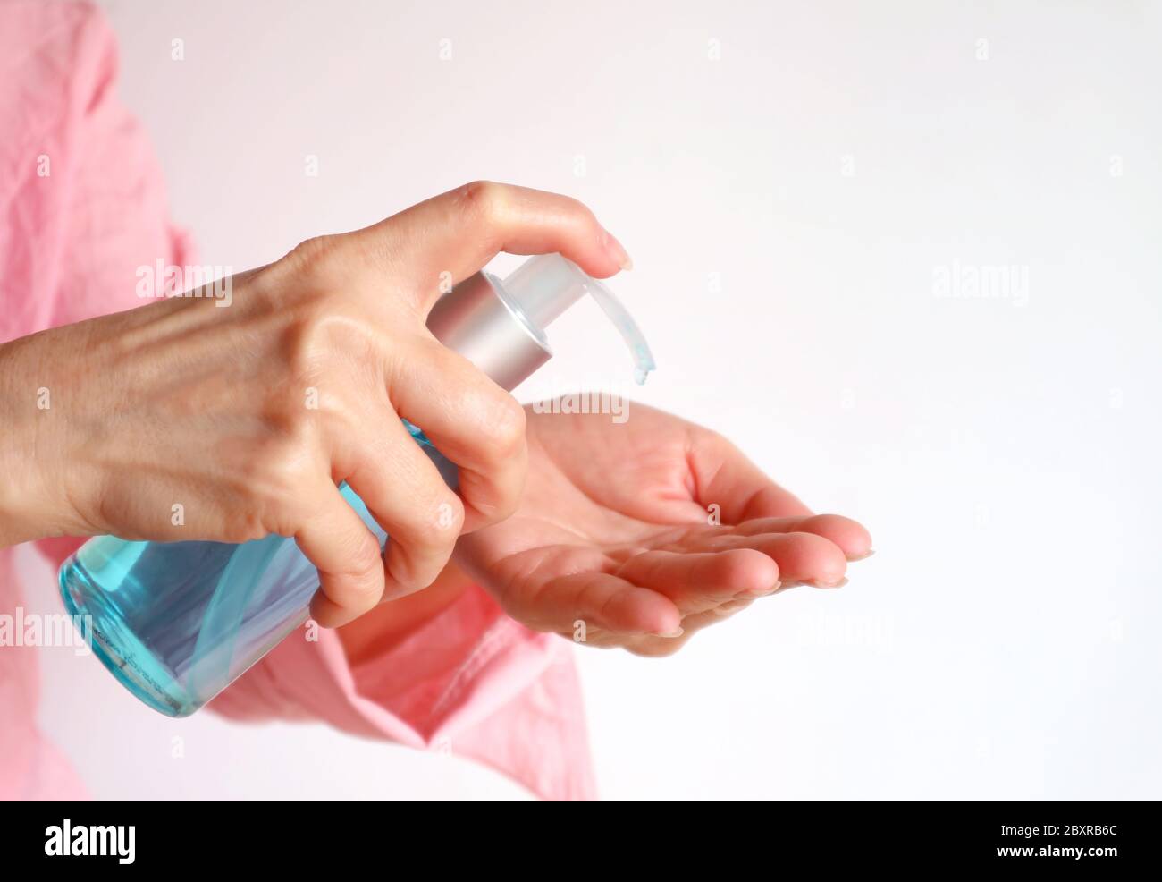 Close Up of Female Hand Pressing Alcohol Hand Rubbing Gel for Hand ...