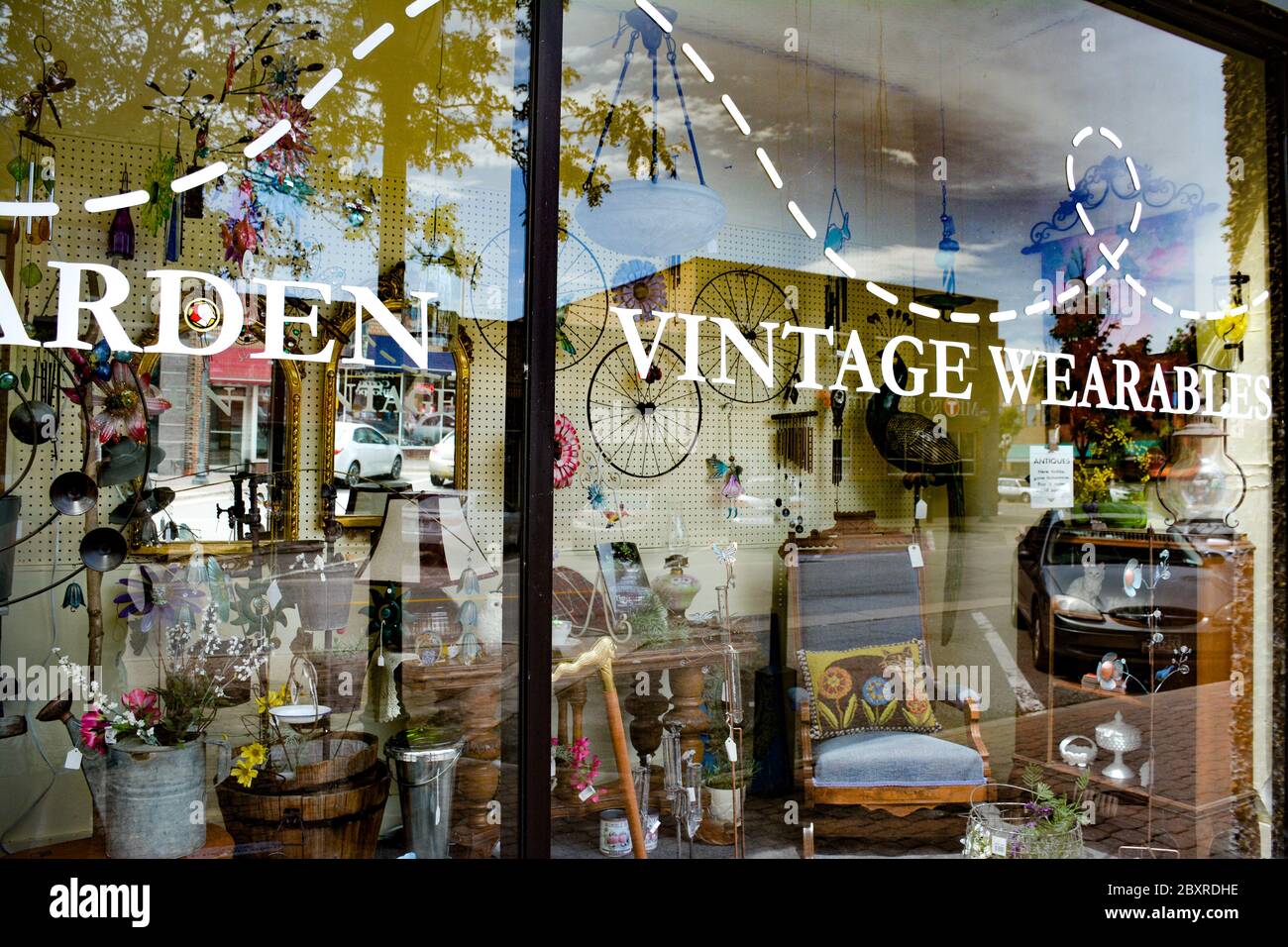 View through the storefront window with signage on the glass of ...