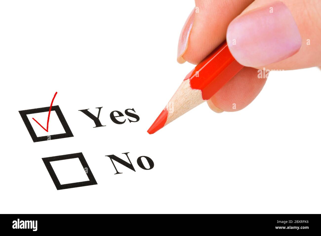 Hand with pencil and check boxes Stock Photo - Alamy