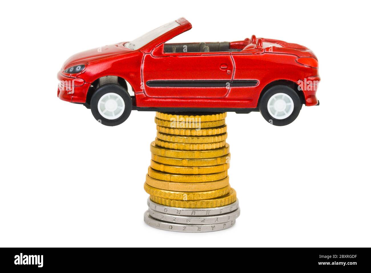 Toy car and stack of coins Stock Photo - Alamy