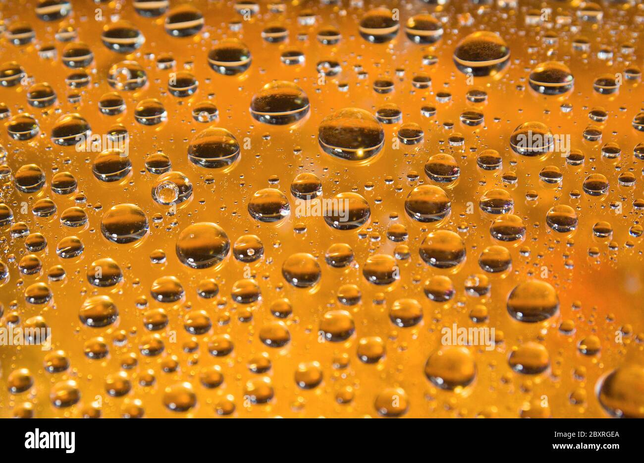 yellow water droplets background .close up Stock Photo - Alamy