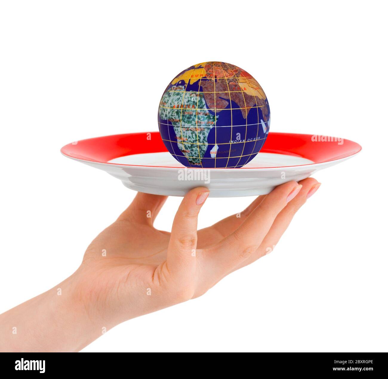 Hand with plate and globe Stock Photo - Alamy