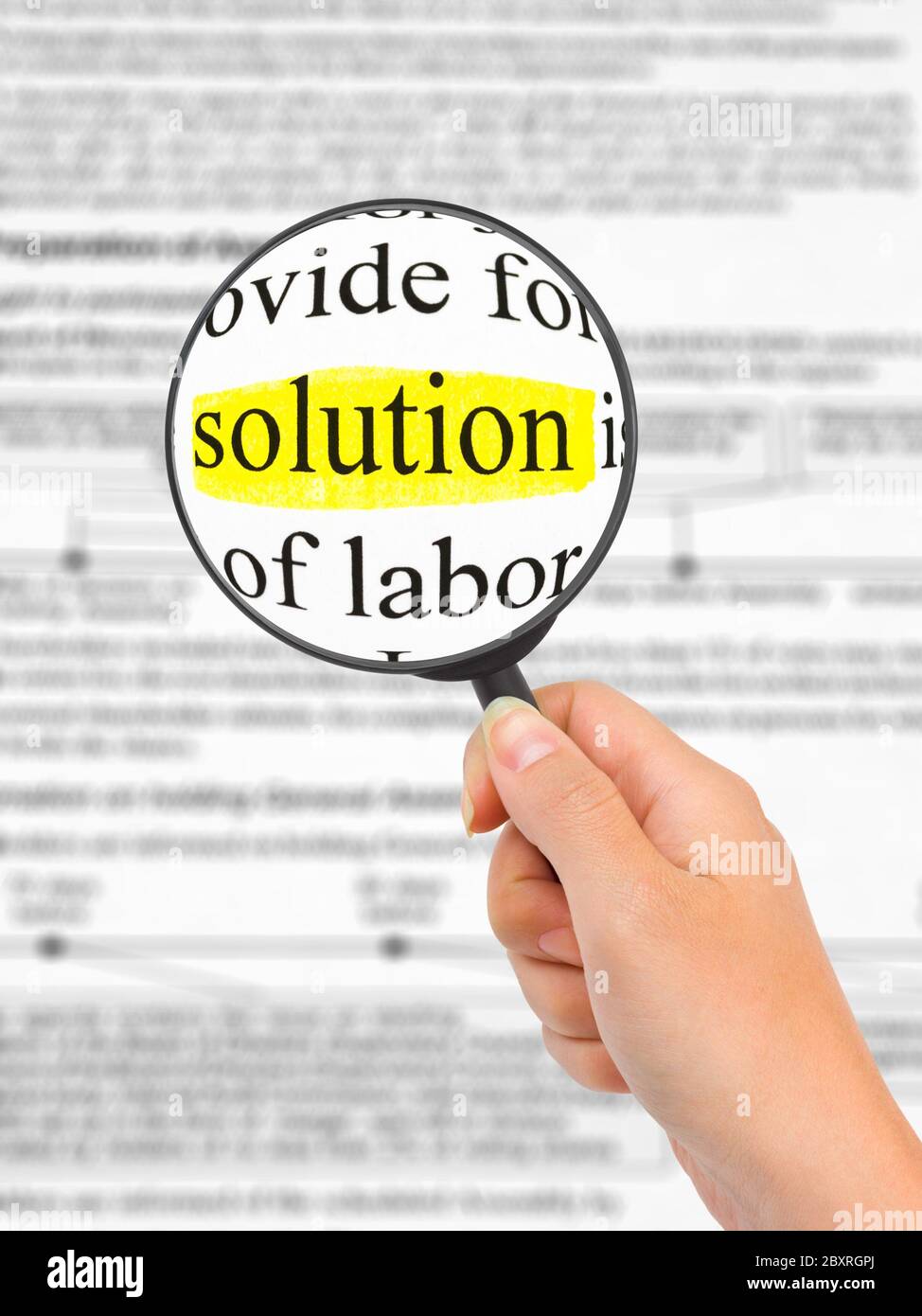 Magnifying glass in hand and word Solution Stock Photo - Alamy