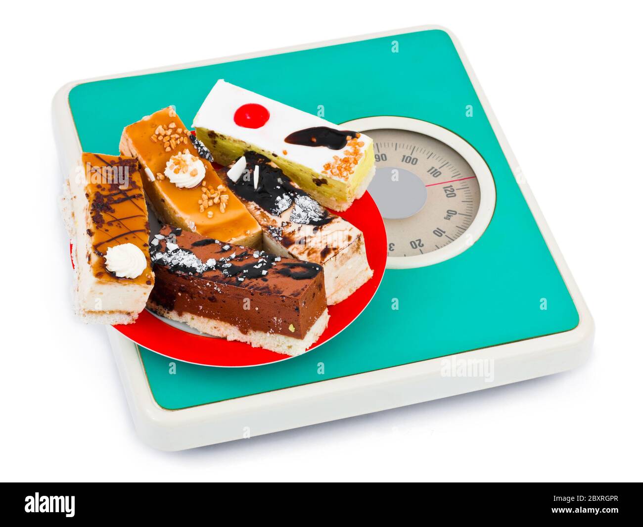 Cakes on weight scale Stock Photo - Alamy