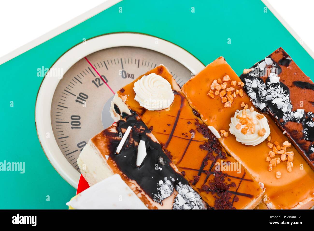 Cakes on weight scale Stock Photo - Alamy