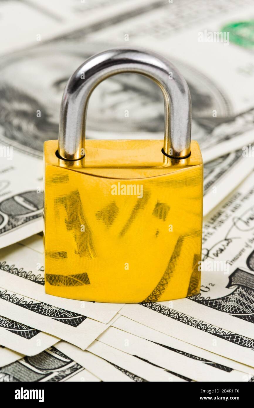 Money and lock Stock Photo - Alamy