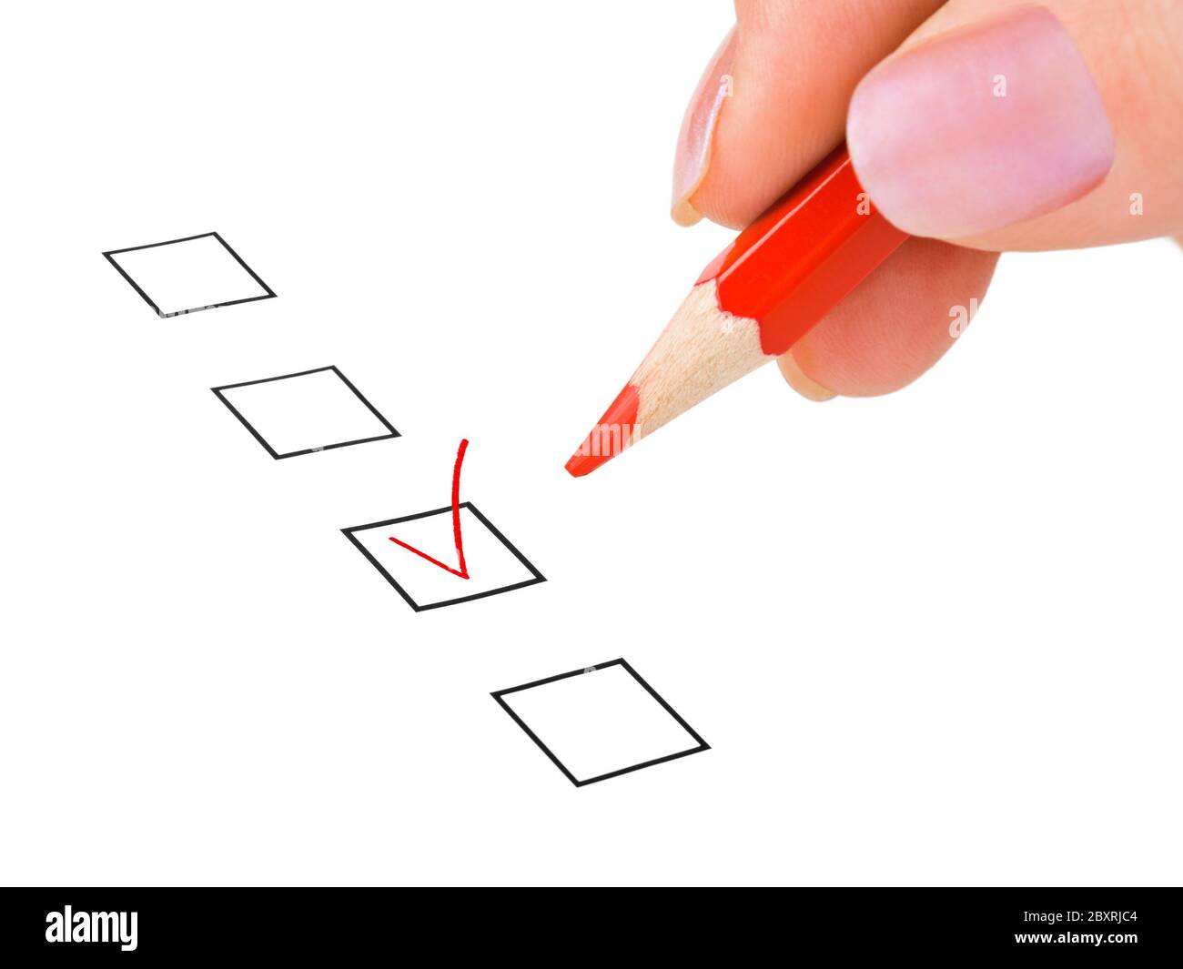Hand with pencil and check boxes Stock Photo - Alamy