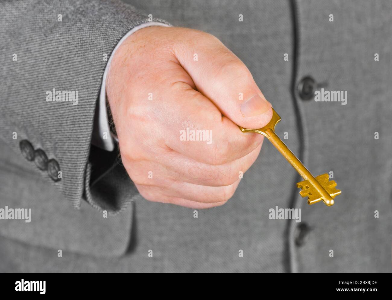 Hand with key Stock Photo - Alamy