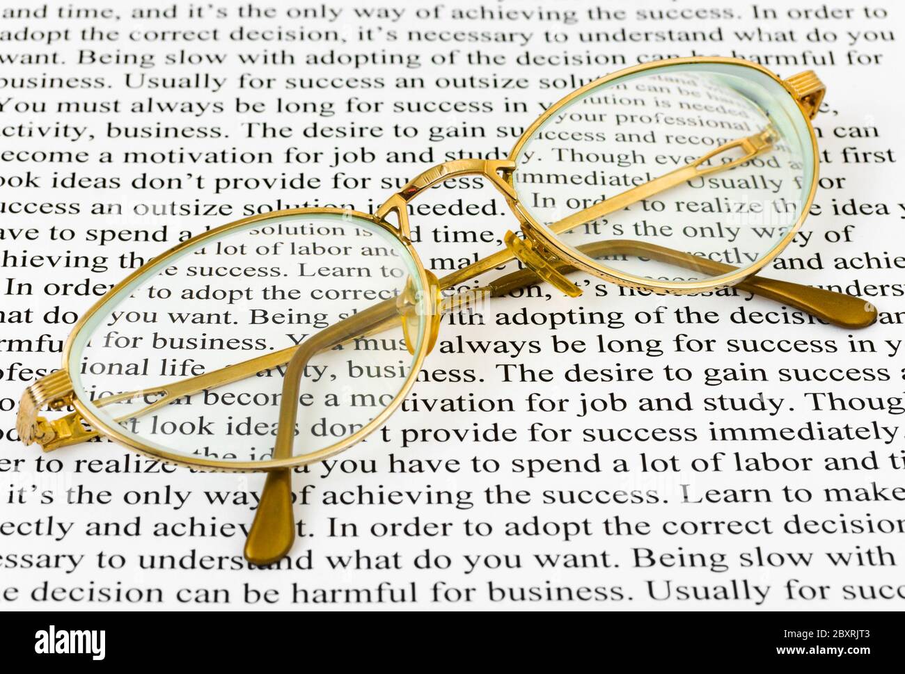 Glasses on business text Stock Photo - Alamy