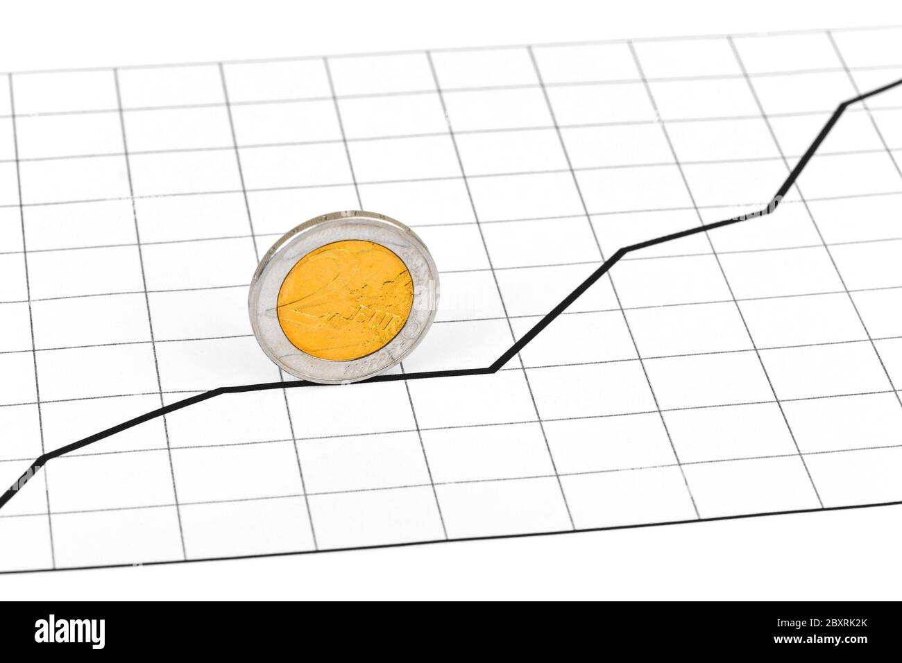 Rolling coin and diagram Stock Photo - Alamy