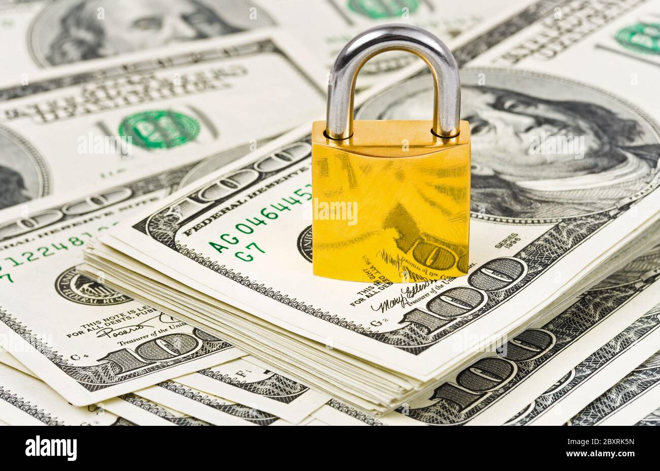 Money and lock Stock Photo - Alamy