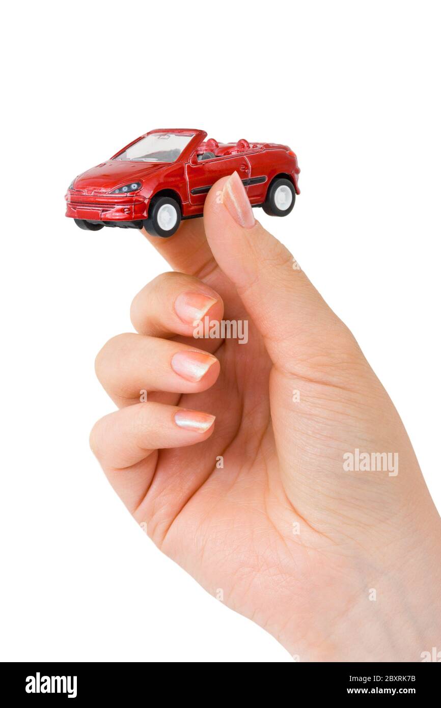 Hand and toy car Stock Photo - Alamy