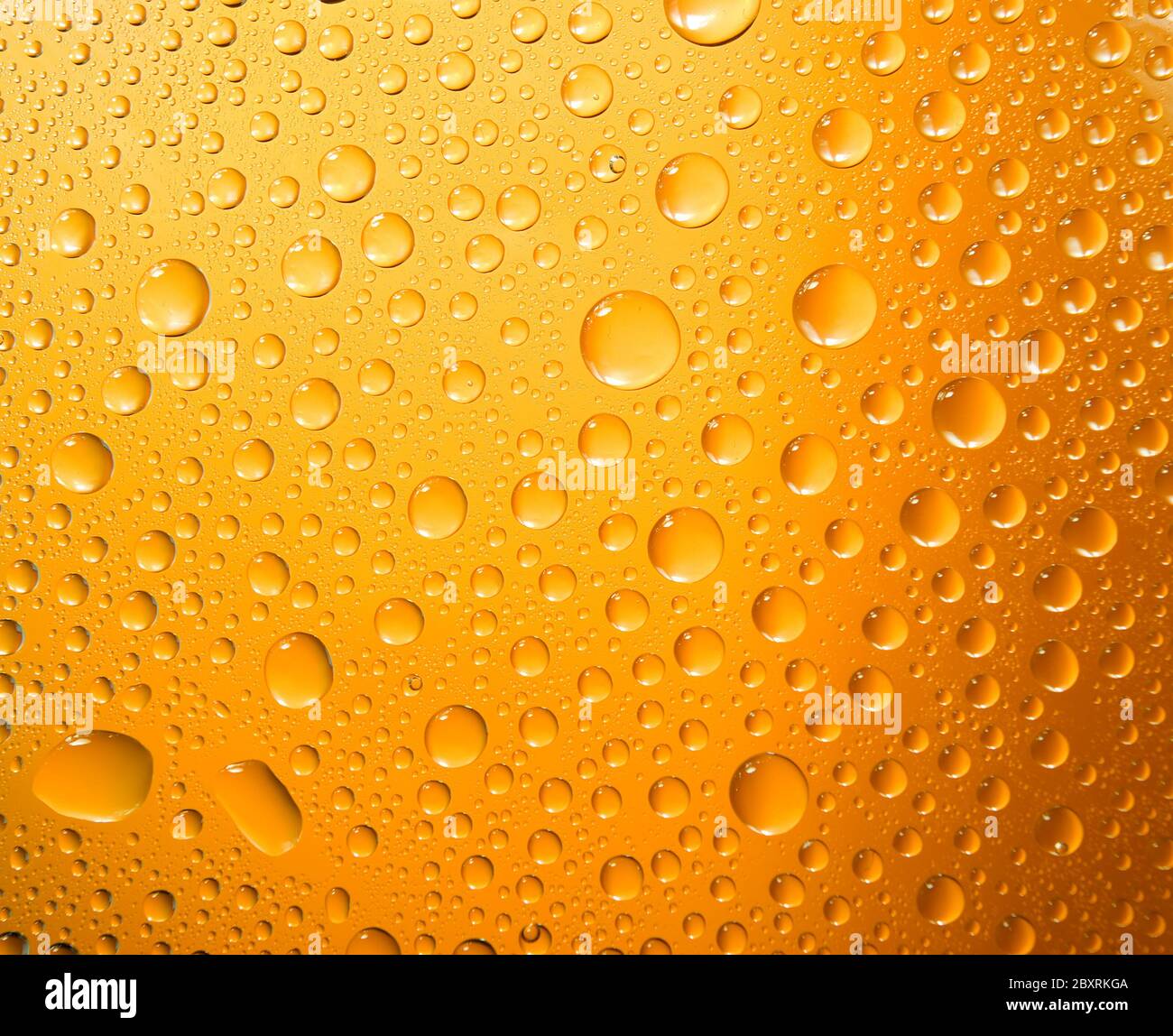 yellow water droplets background Stock Photo - Alamy