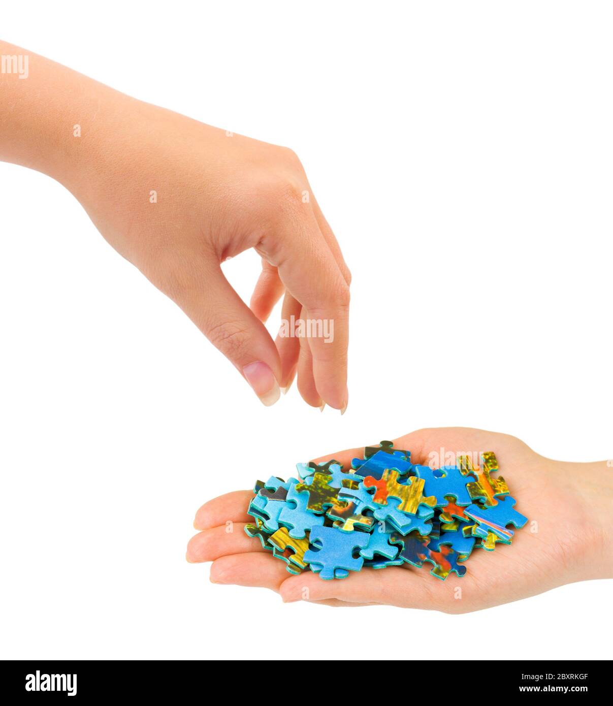 Hands and puzzle Stock Photo - Alamy