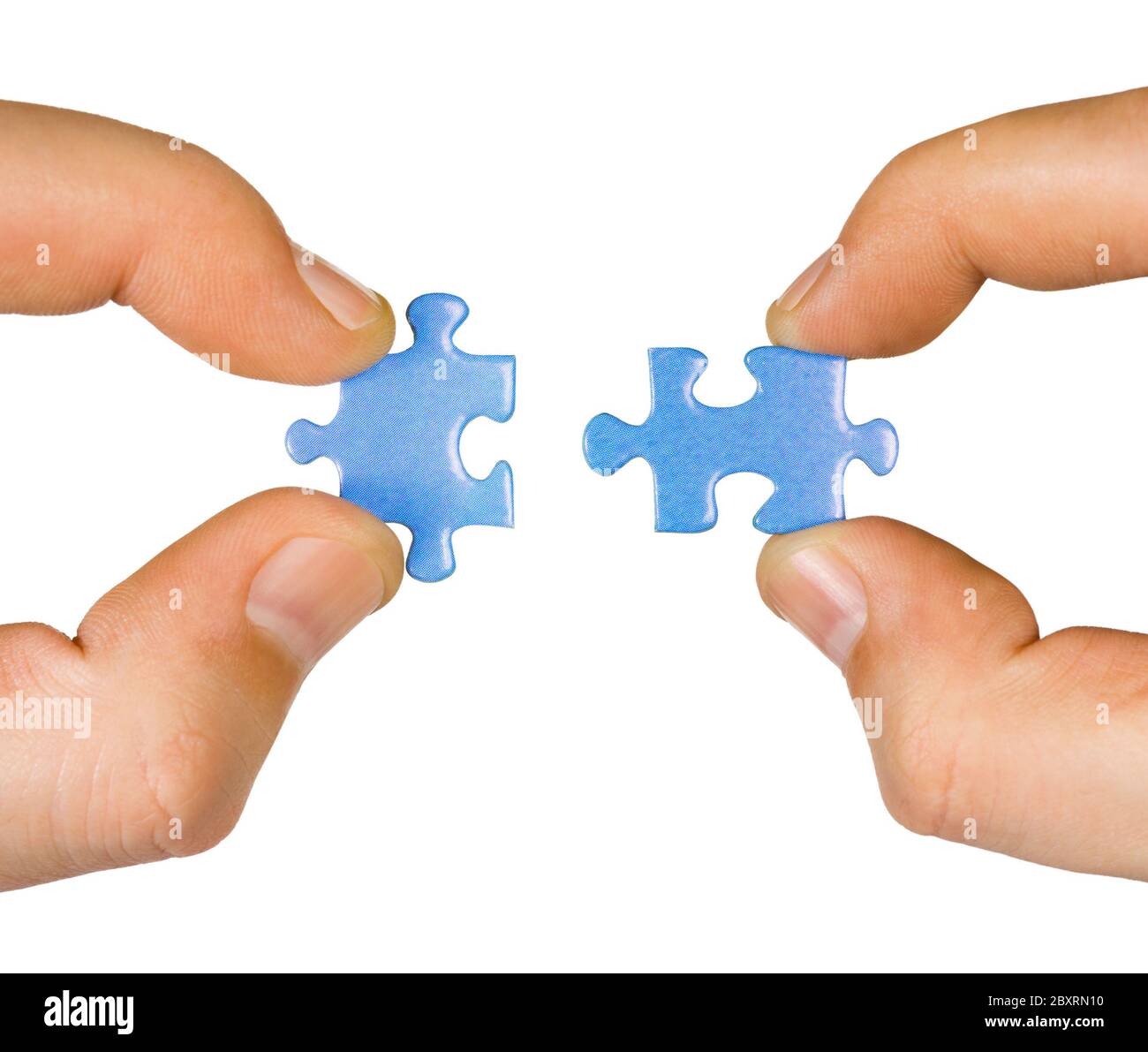 Hands holding puzzle piece business Cut Out Stock Images & Pictures - Alamy