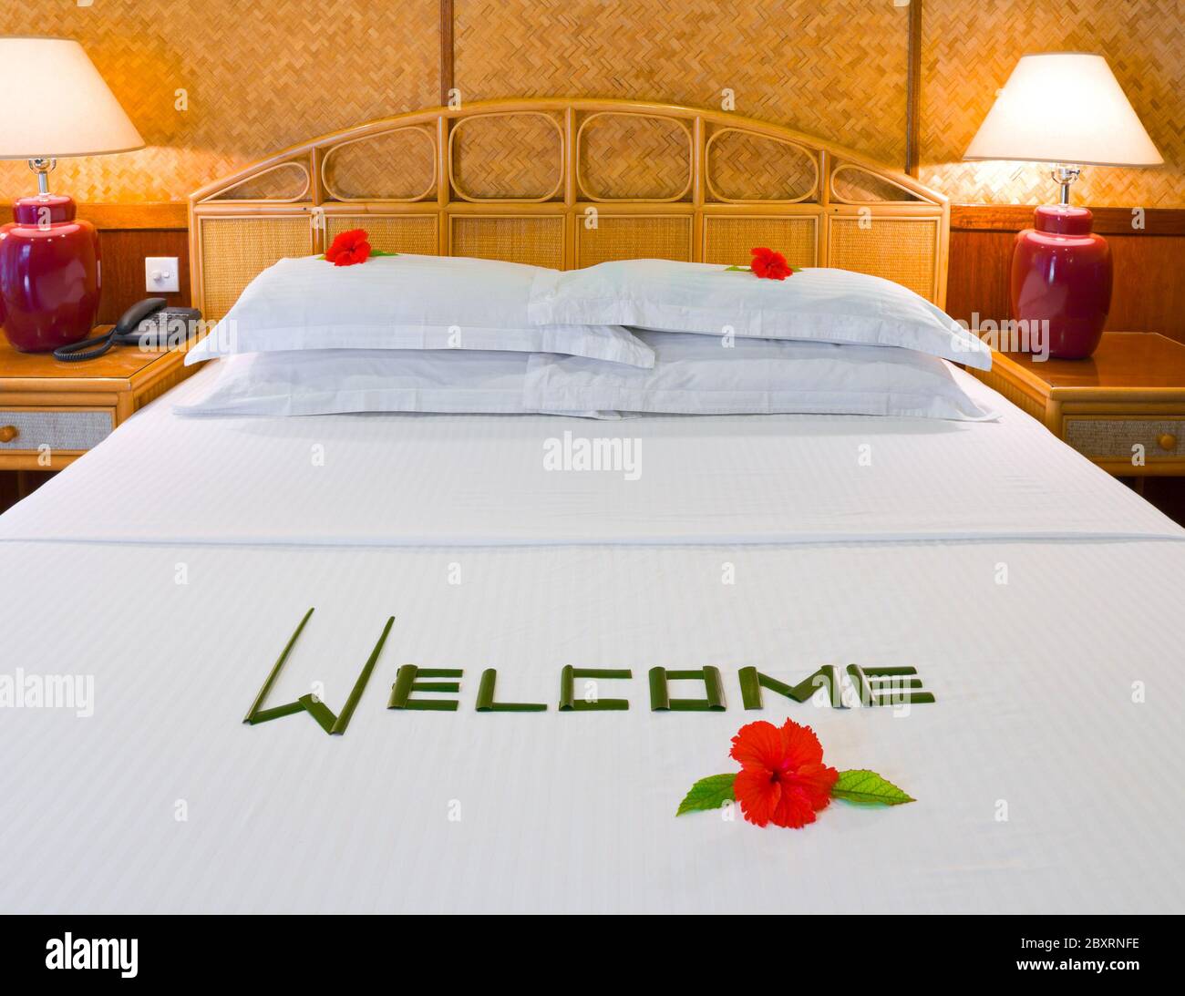 Word Welcome and flowers on bed Stock Photo - Alamy