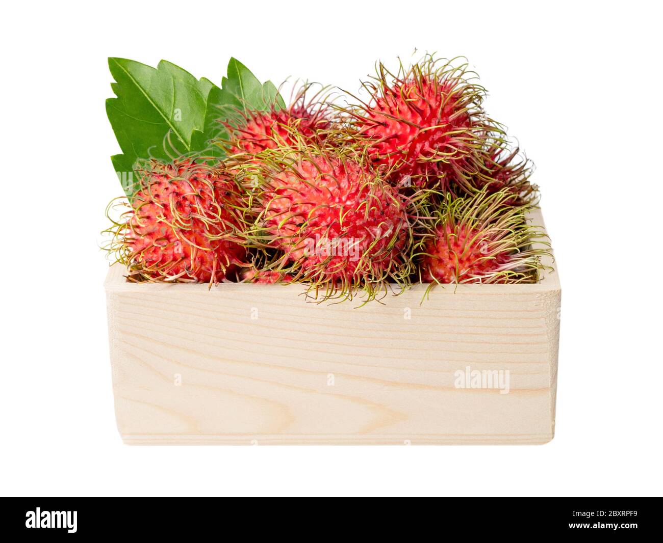 Rambutan fruit in wooden box isolate on white background Stock Photo ...