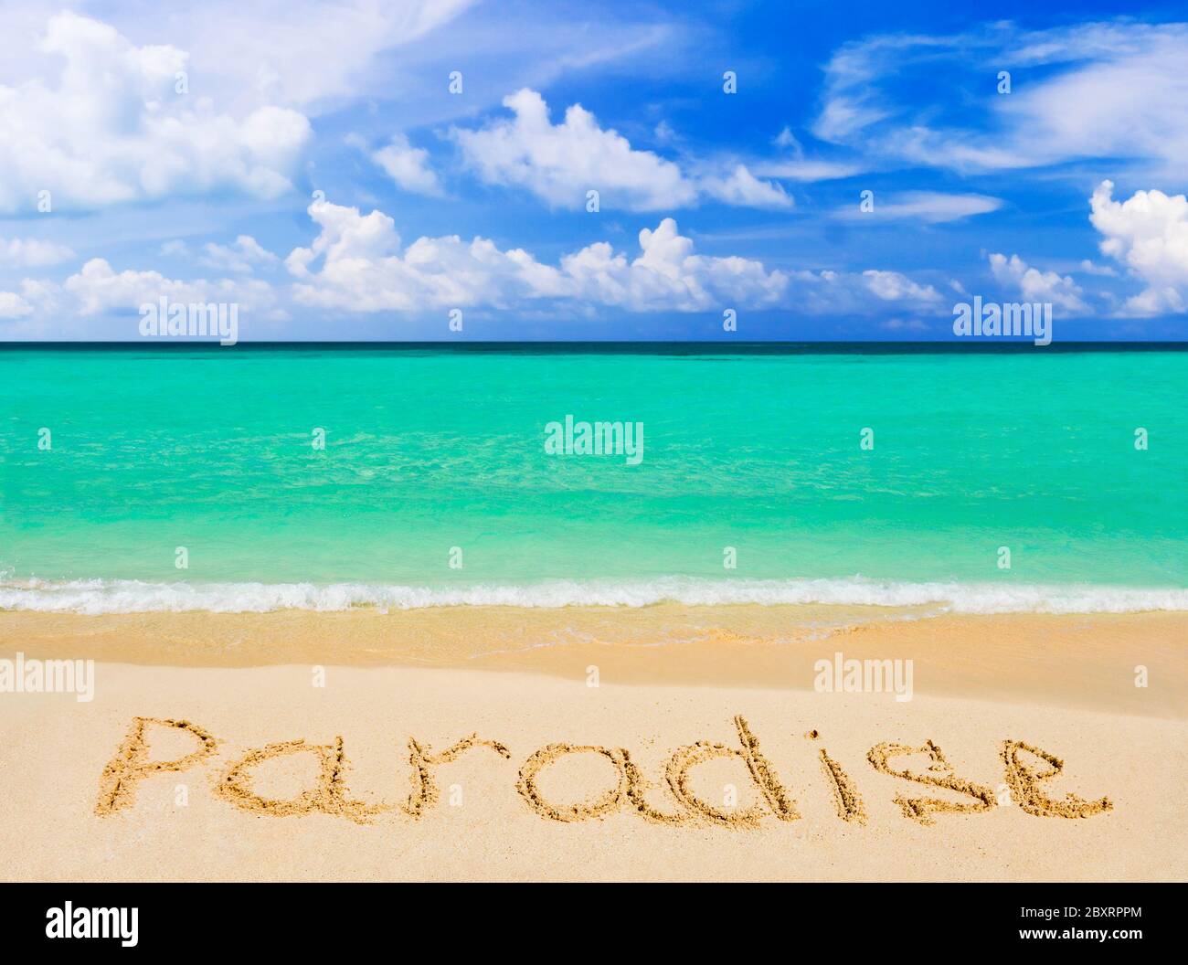 Word Paradise on beach Stock Photo - Alamy